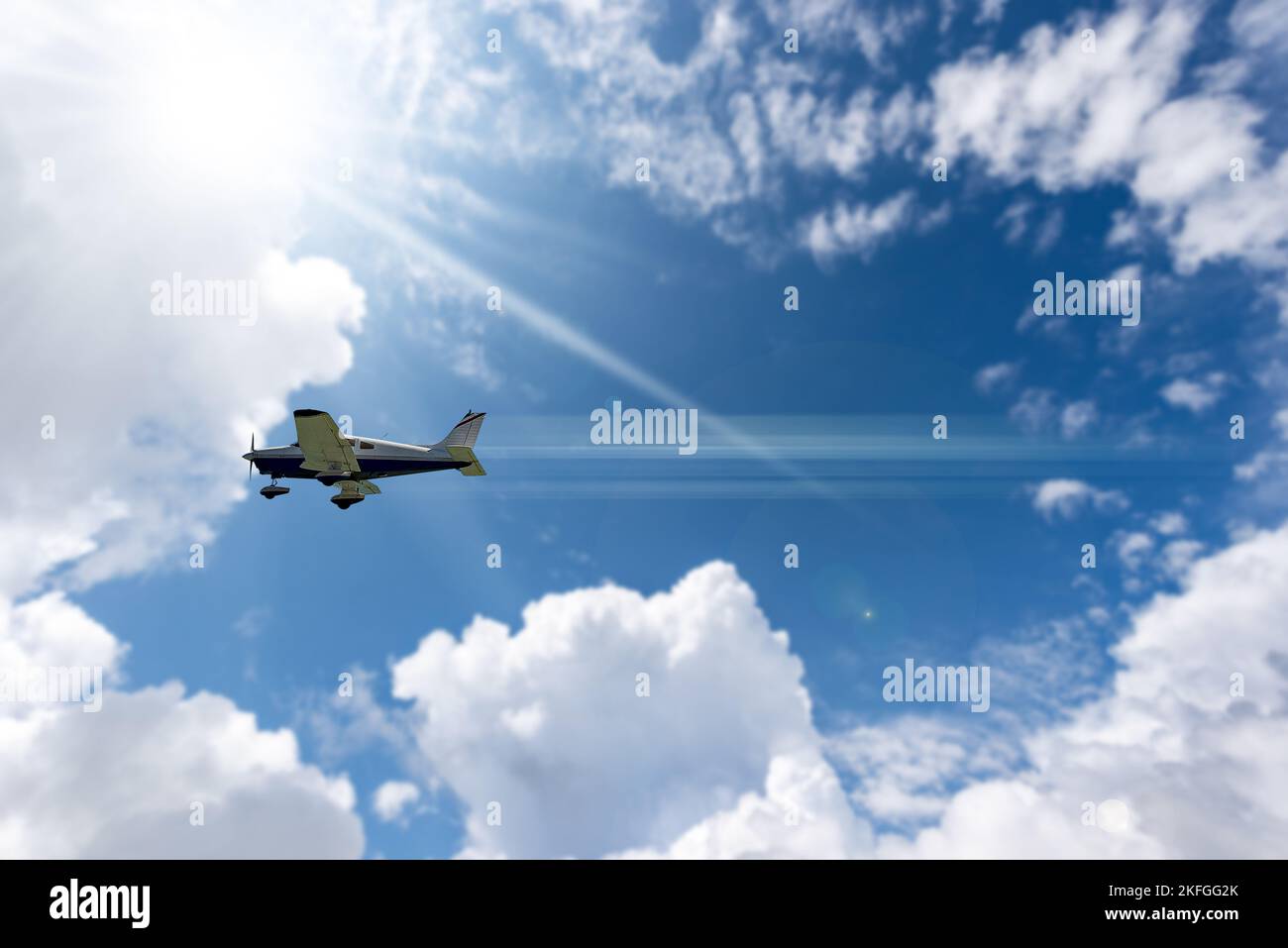 Small private propeller airplane in motion against a beautiful clear ...