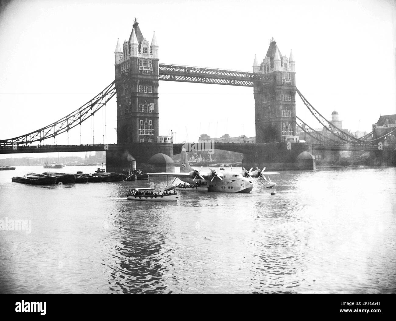 1949, historical, a seaplane sat on the river Thames at Tower Bridge ...