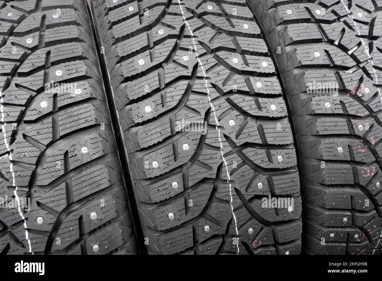 Winter studded tire. Winter car tires background. Tire stack background ...