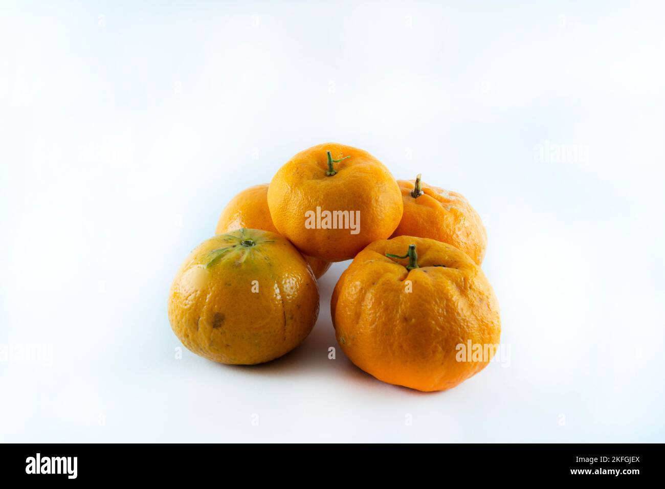 A pile of fresh juicy mandarins isolated in white background Stock ...