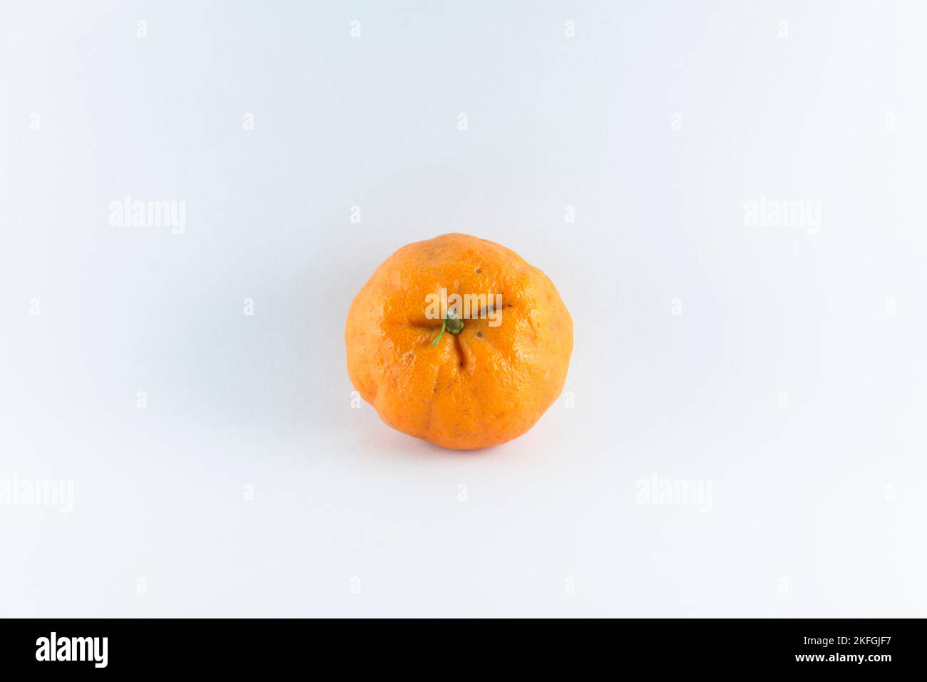 A ripe mandarin isolated in white background Stock Photo - Alamy