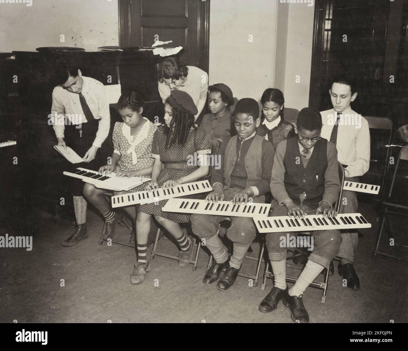 Music classes, keyboards, 1938 Stock Photo - Alamy
