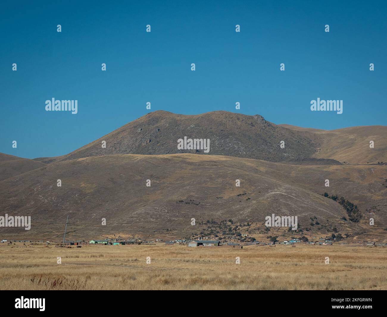 Mountains in the Midst of Dry and Yellow Soil in Contrast to a ...