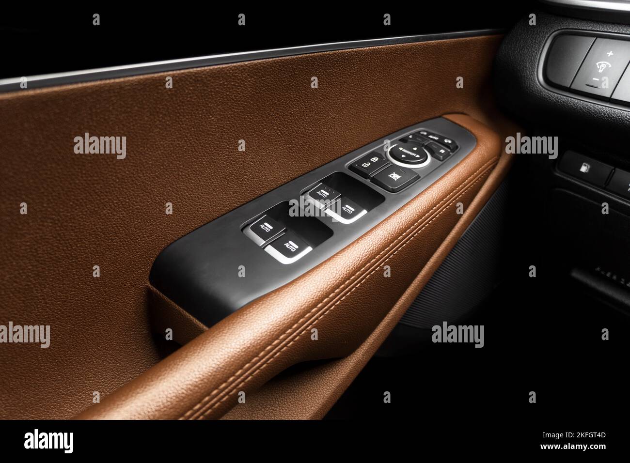 Door handle with power window control buttons of a luxury passenger car ...