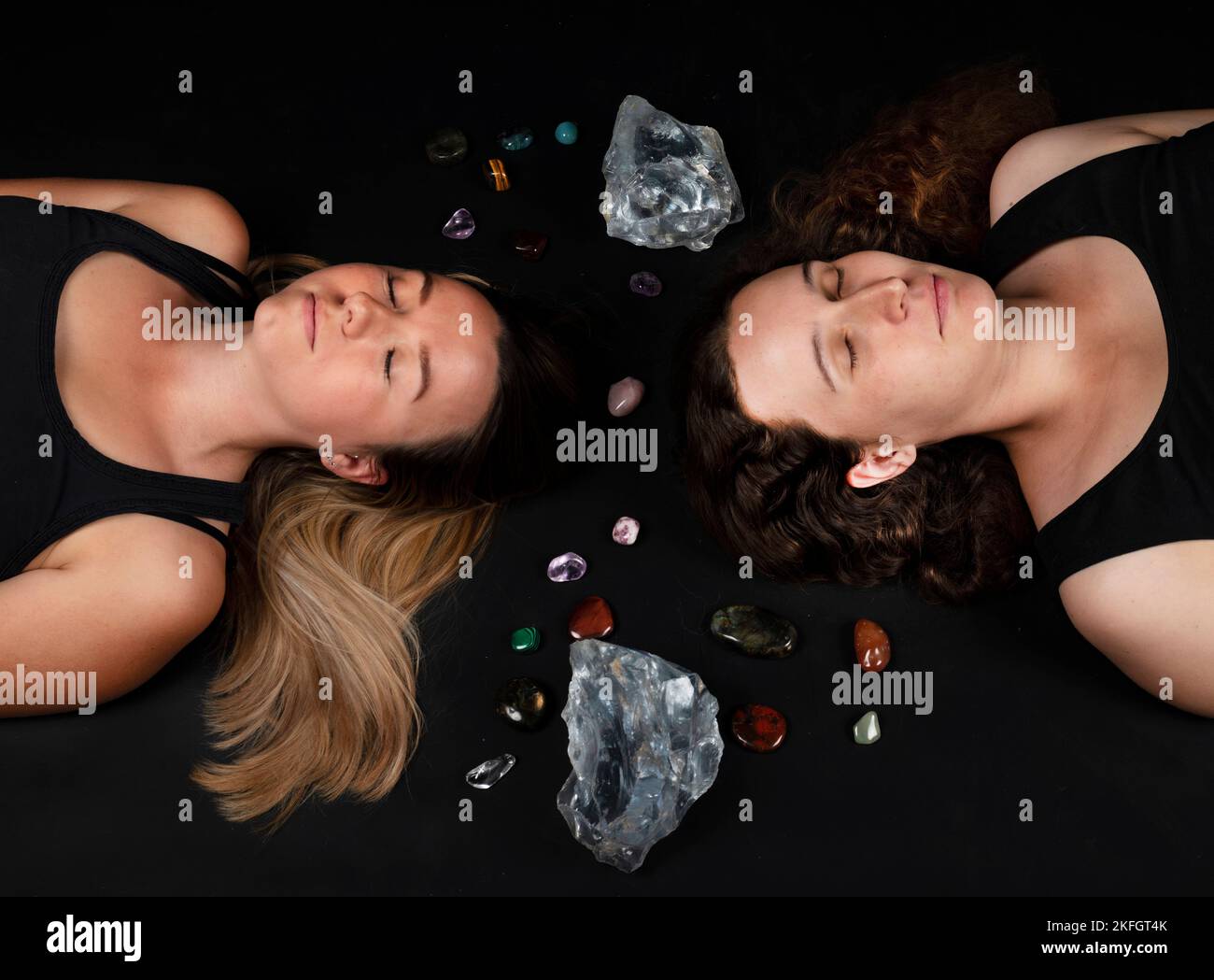 woman and energy healing in front of black background Stock Photo - Alamy
