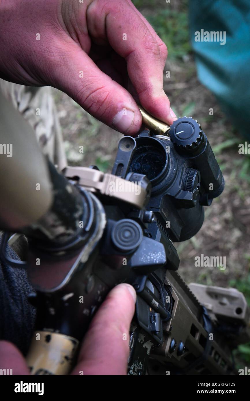 A U.S. Green Beret from 10th Special Forces Group (Airborne), adjusts ...