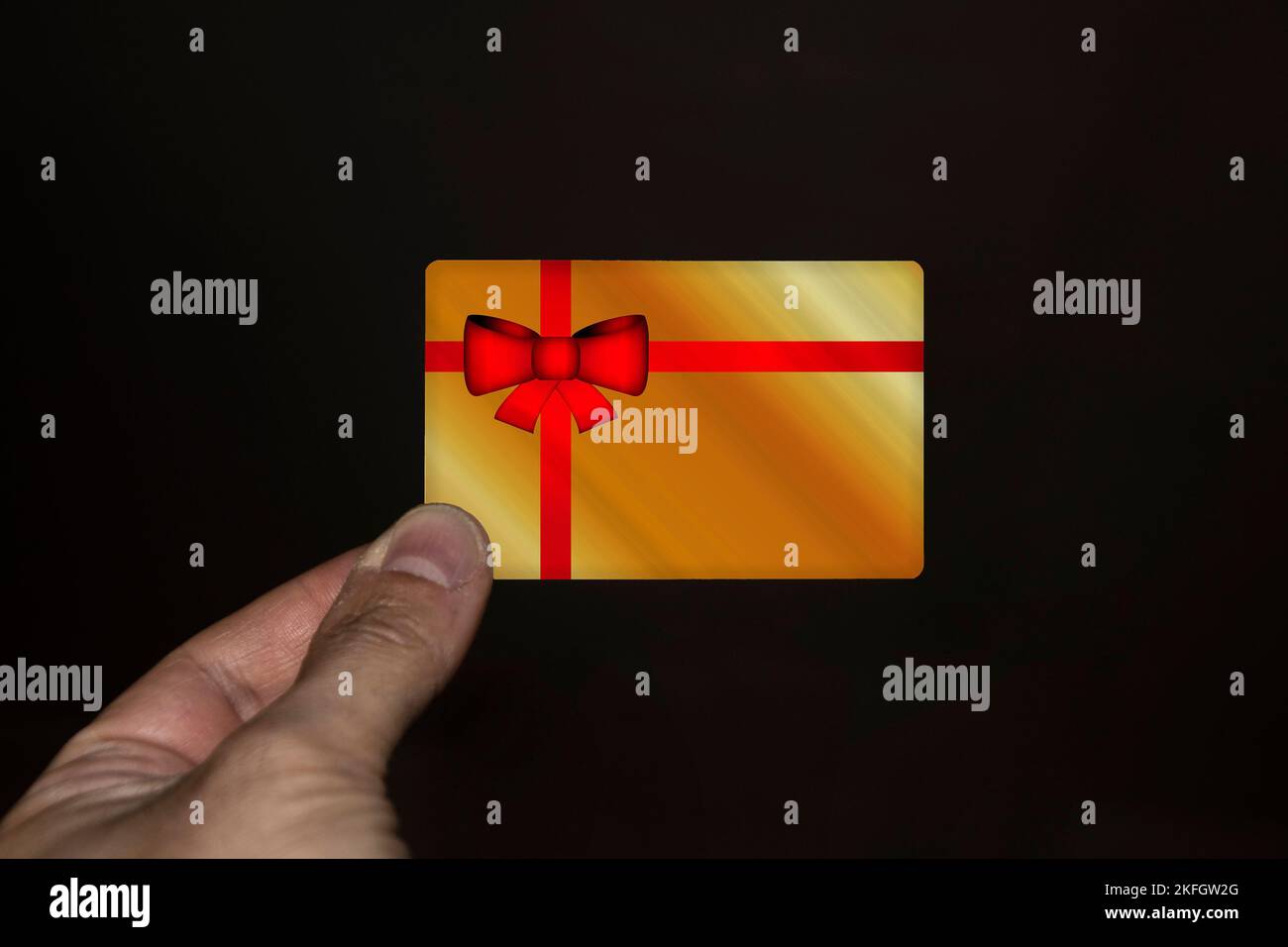 Hand holding a gift card Stock Photo - Alamy