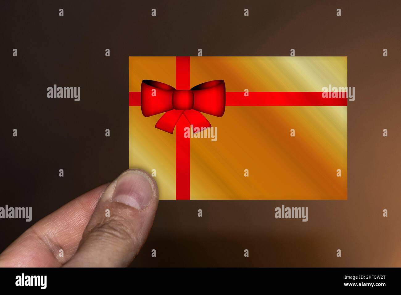 Hand holding a gift card Stock Photo - Alamy