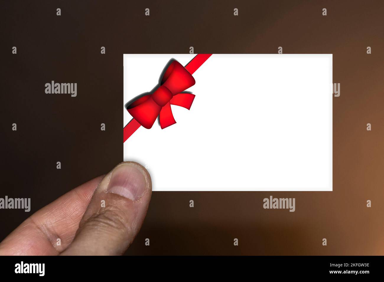 Hand holding a gift card Stock Photo - Alamy