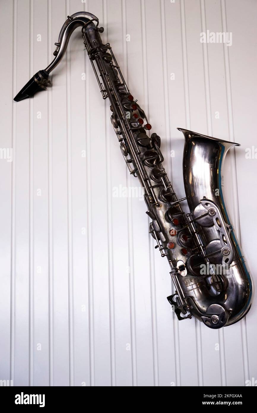 Very old silver saxophone on the white background Stock Photo - Alamy
