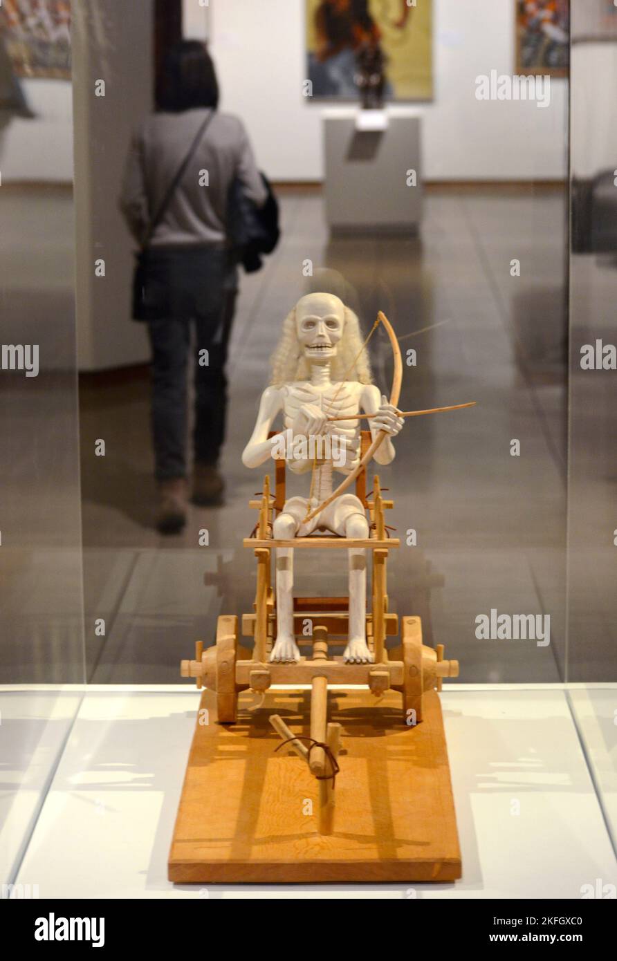 A wood sculpture by Hispanic artist Raymond Lopez titled "Carreta de la ...