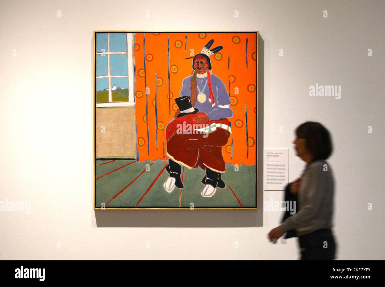 A museum visitor admires a painting by Native-American artist T.C ...