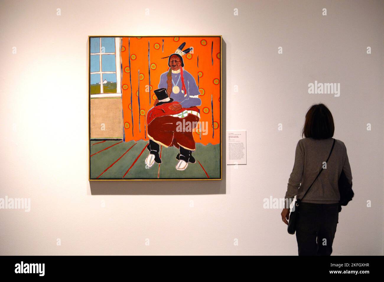 A museum visitor admires a painting by Native-American artist T.C ...
