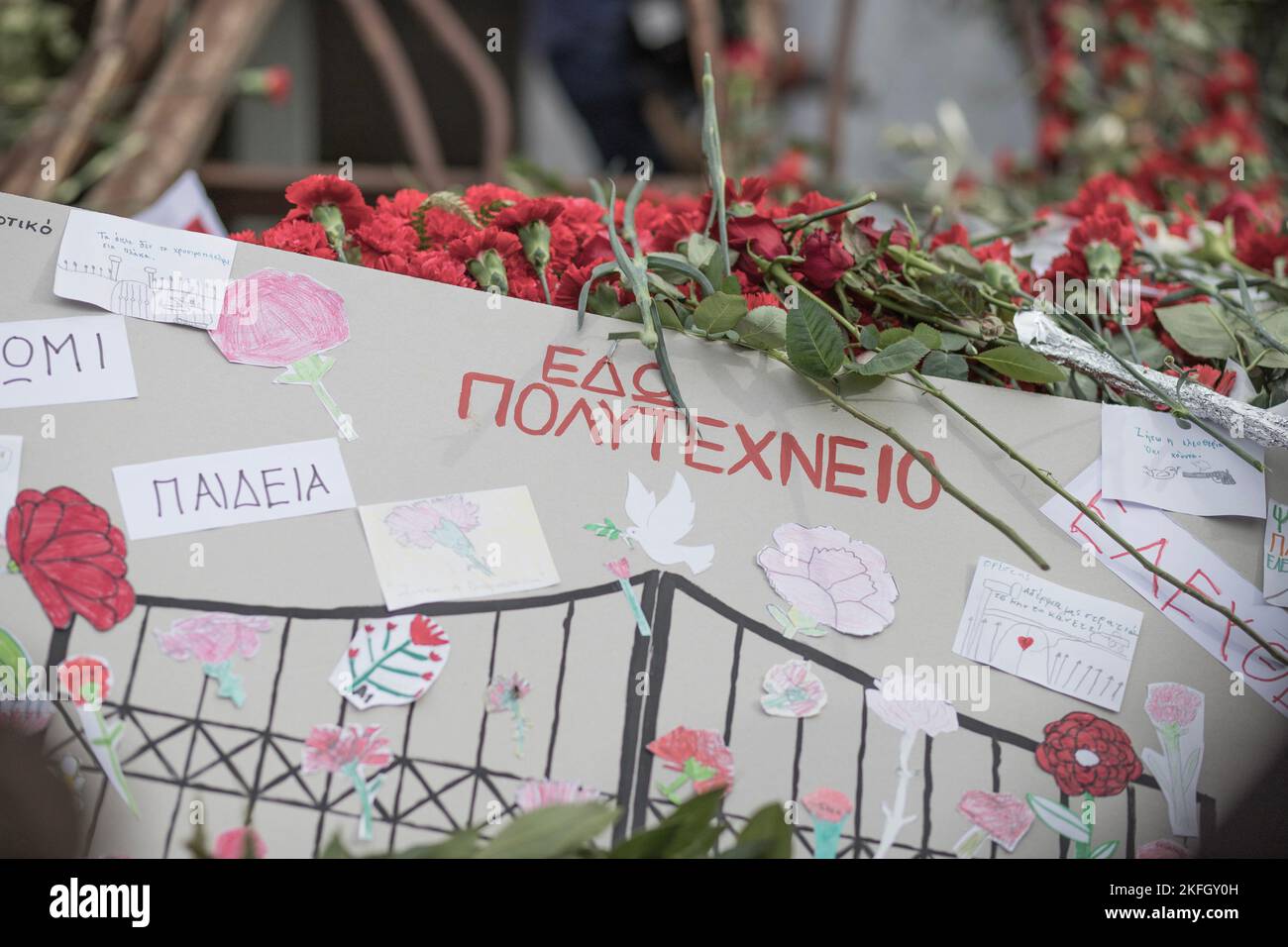 Athens, Greece. 17th Nov, 2022. Adults and children lay flowers ...