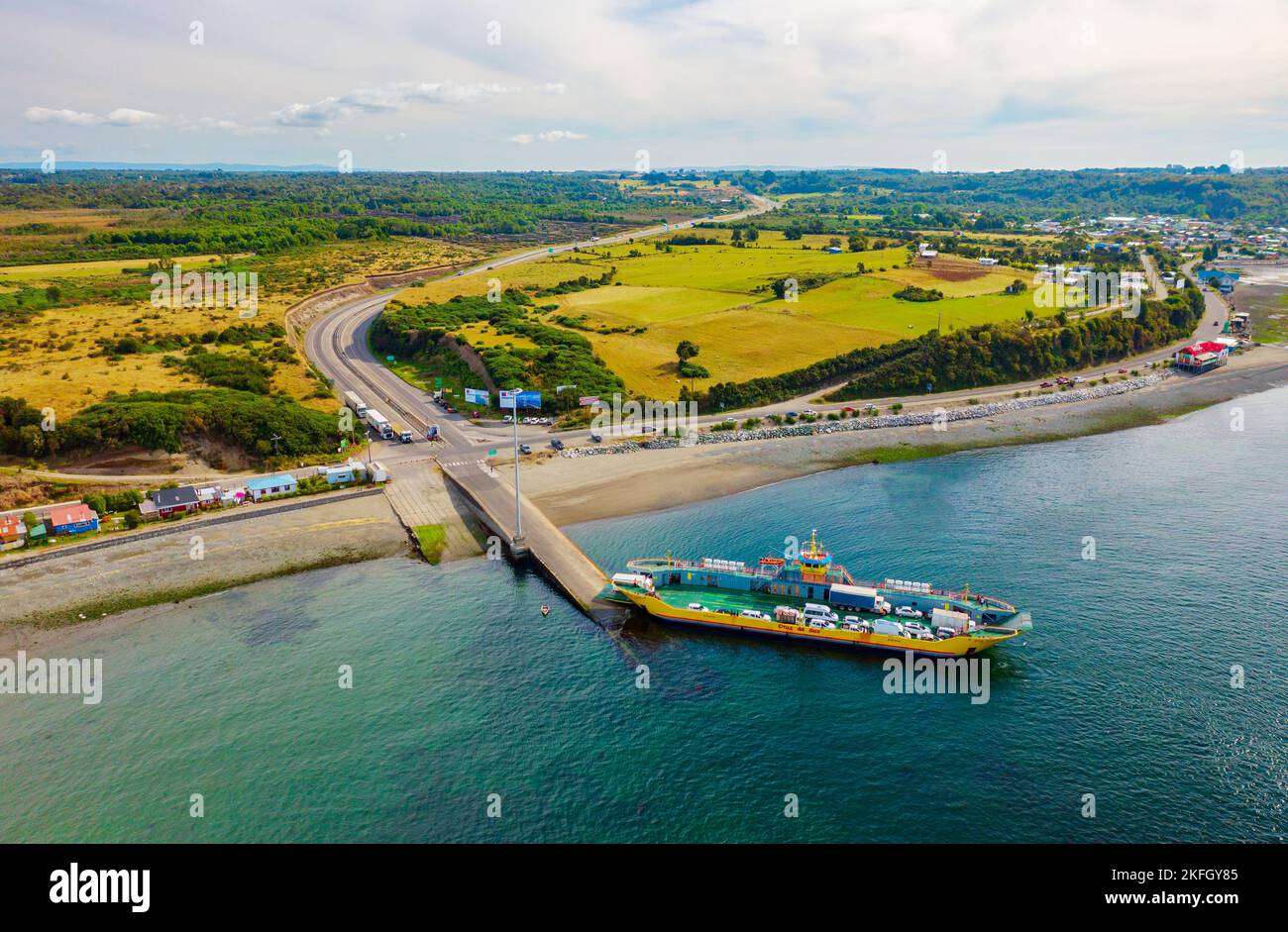 The aerial view of a ferry by the coast of Chiloe Island in Chacao ...