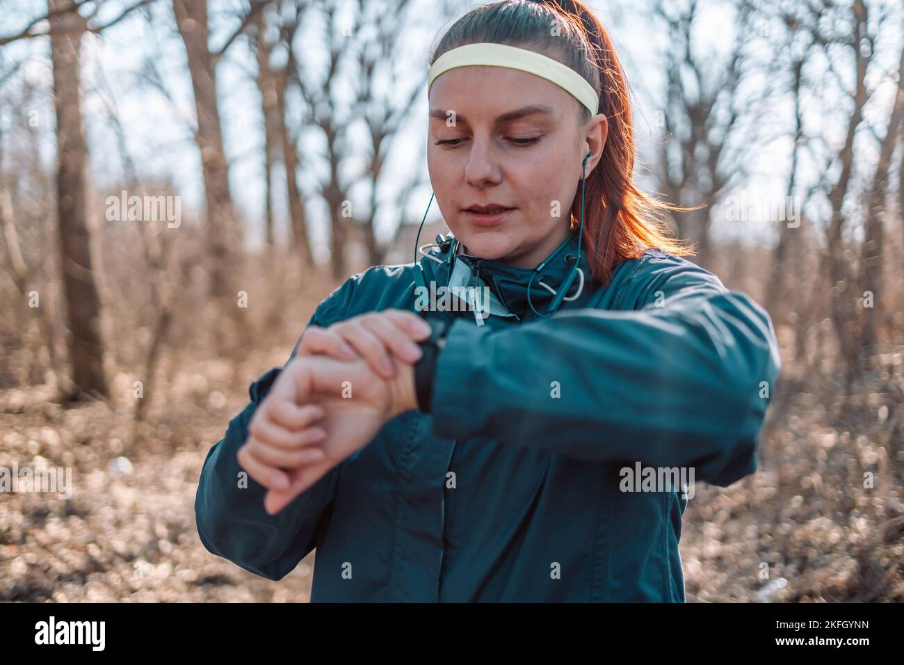 Sport watch run woman checking smartwatch tracker. Trail running runner ...