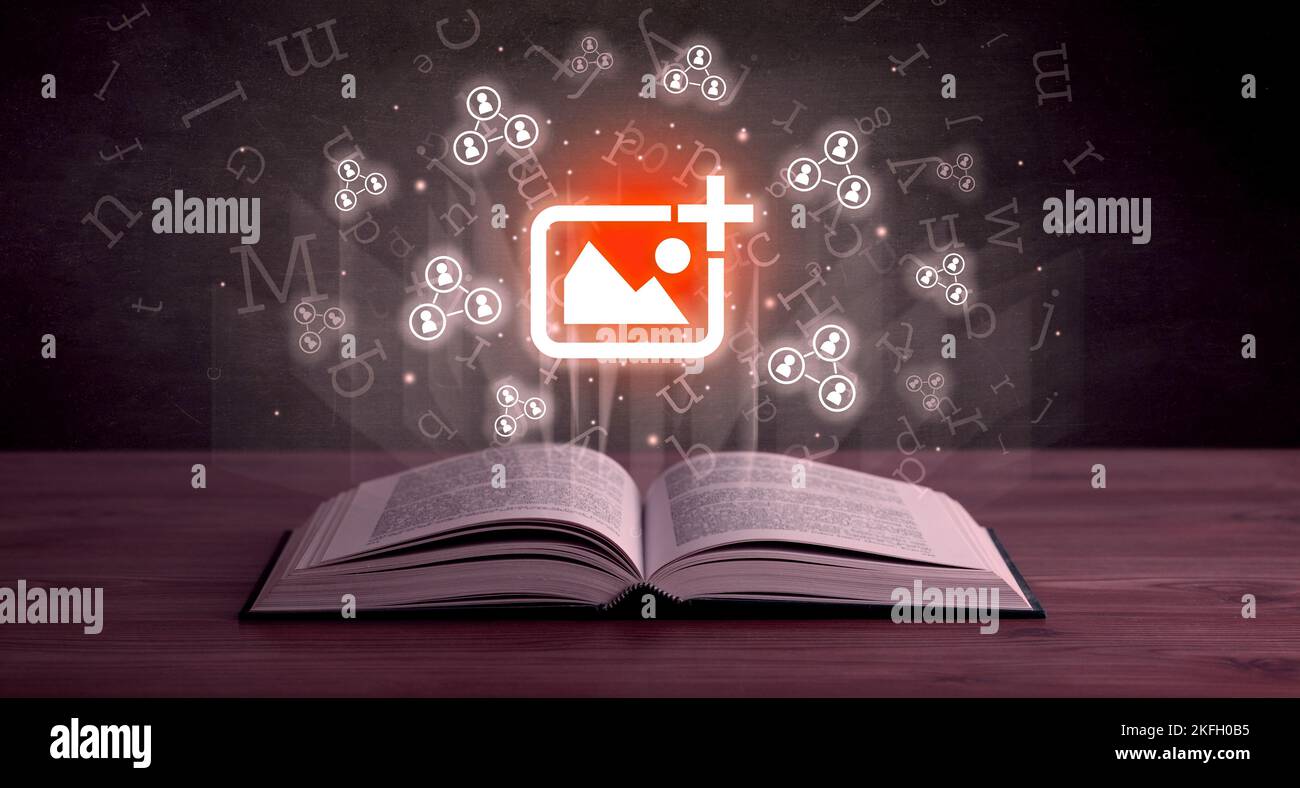 Open book with social networking icons above Stock Photo - Alamy