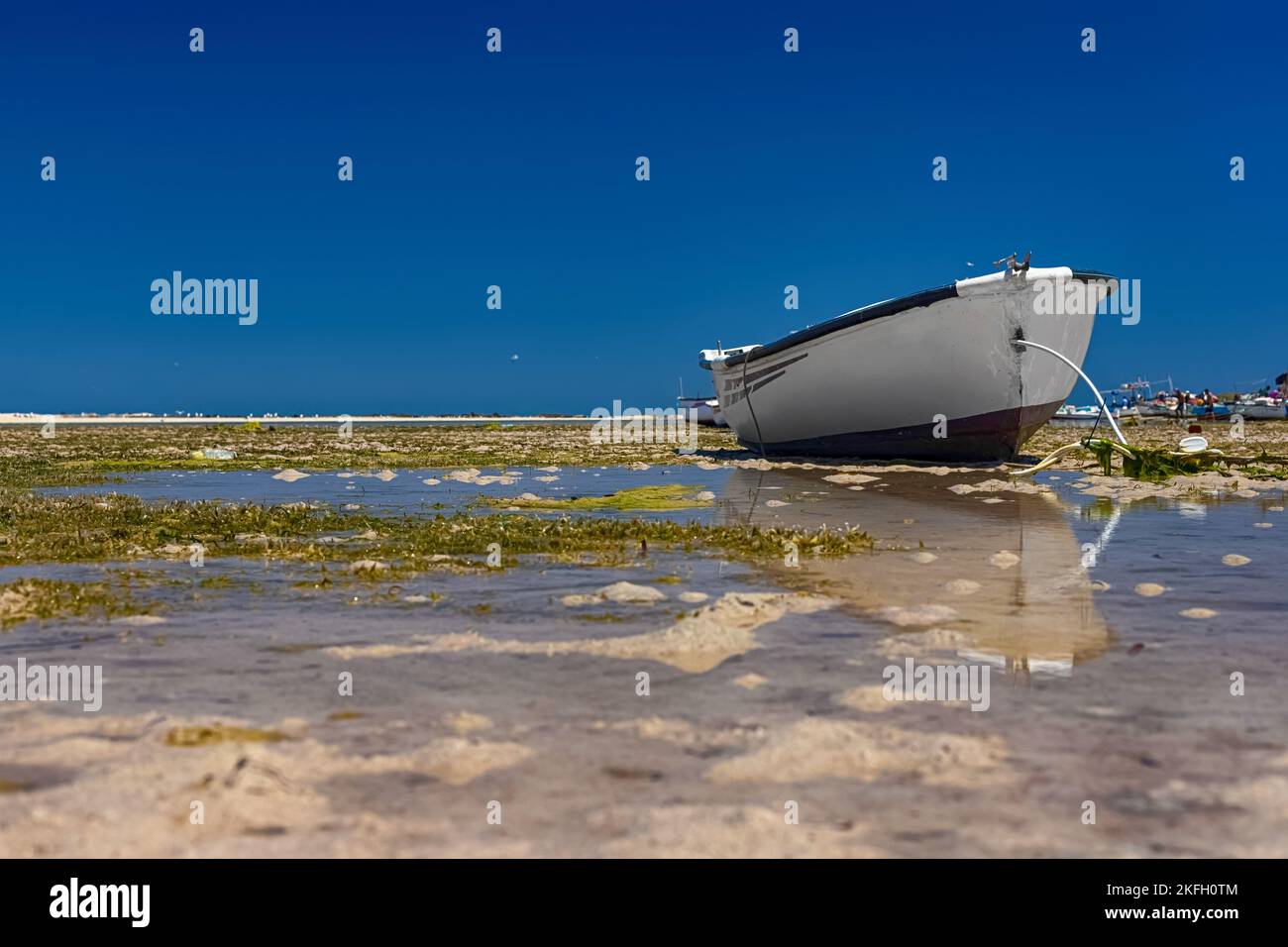 Beautiful view of the boat in the bay of the Mediterranean Sea at low ...