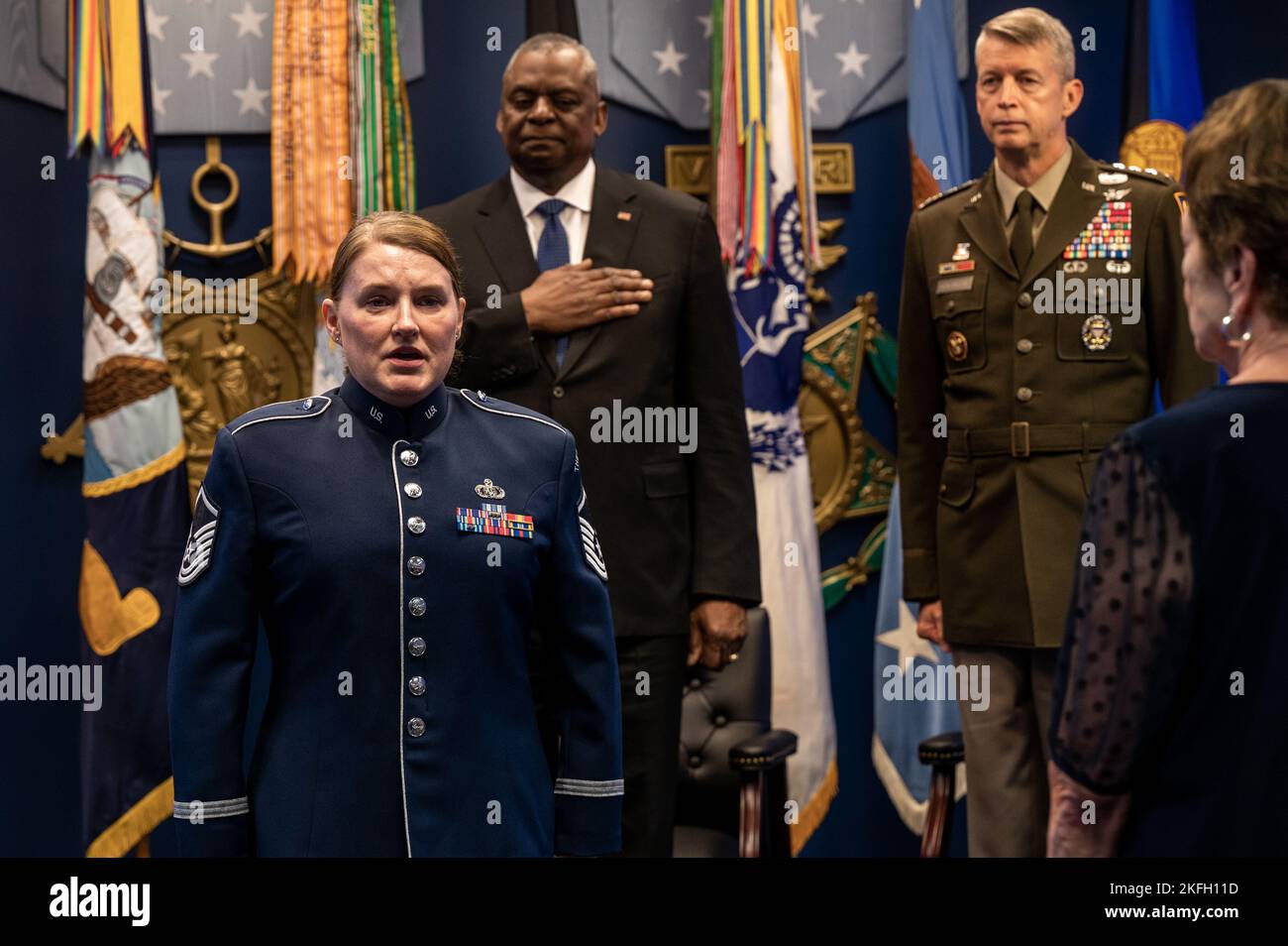 Secretary of Defense Lloyd J. Austin III renders honors as a soloist ...