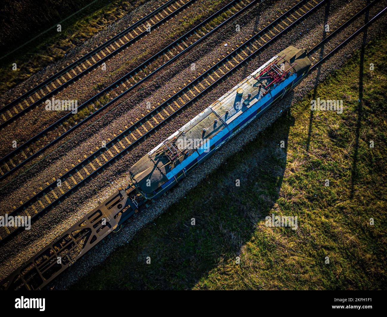 Aerial view of cargo train, a double-track railway in countryside ...