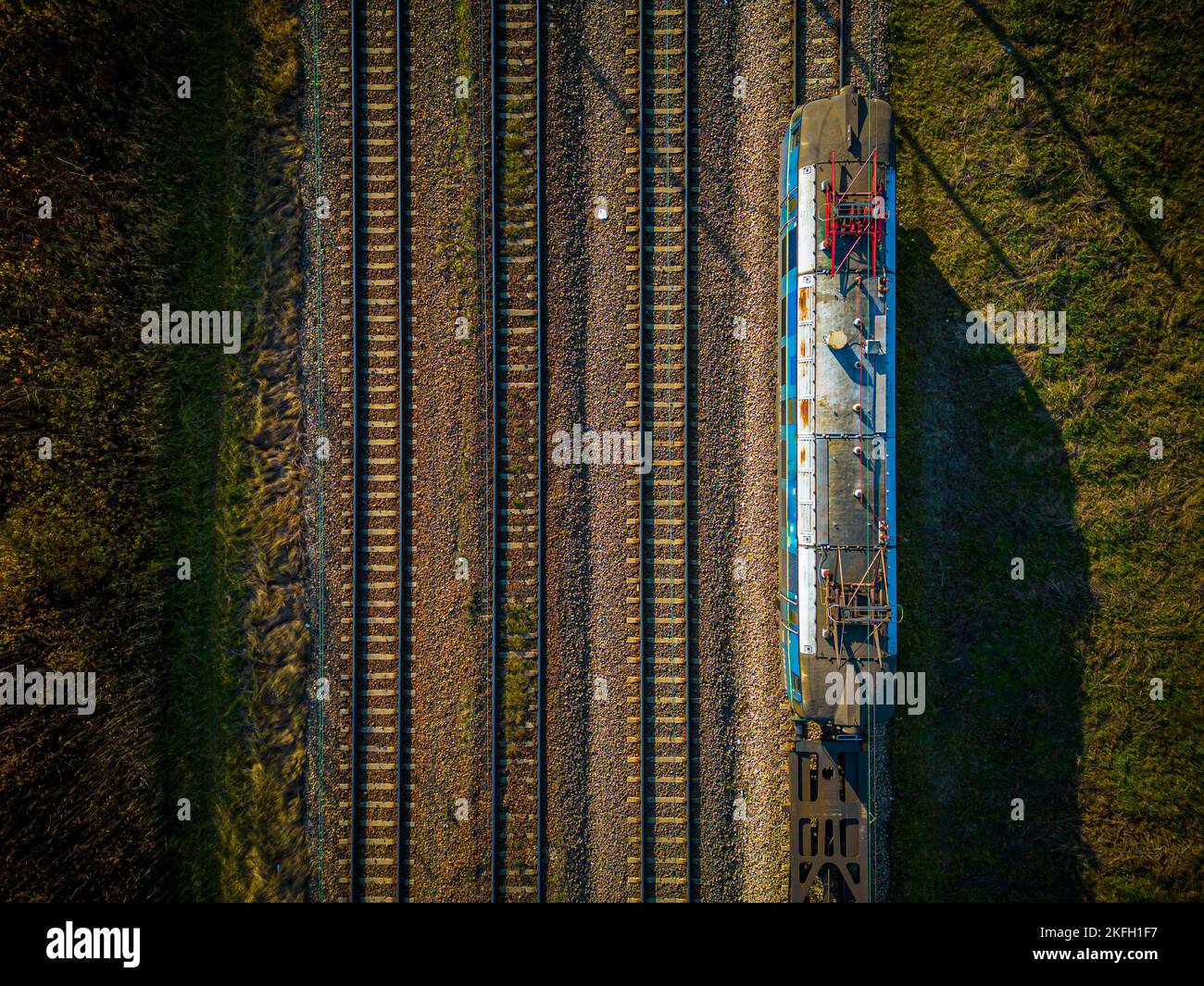 Aerial view of cargo train, a double-track railway in countryside ...