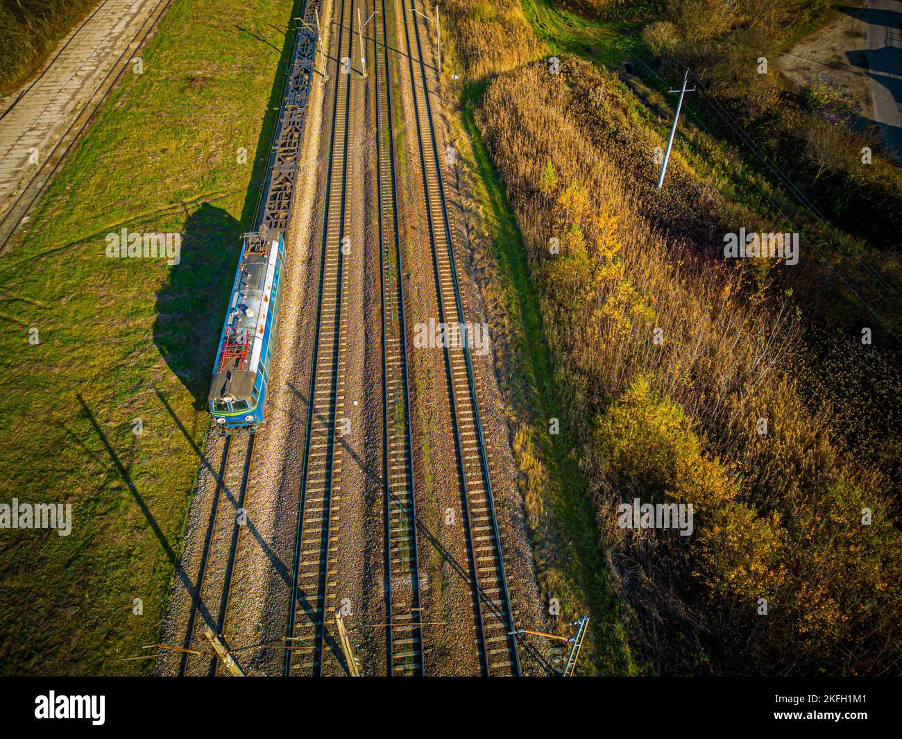Aerial view of cargo train, a double-track railway in countryside ...