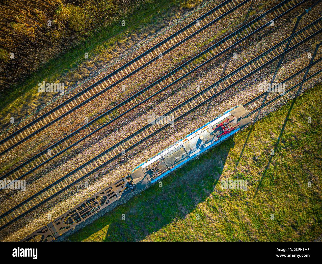 Aerial view of cargo train, a double-track railway in countryside ...