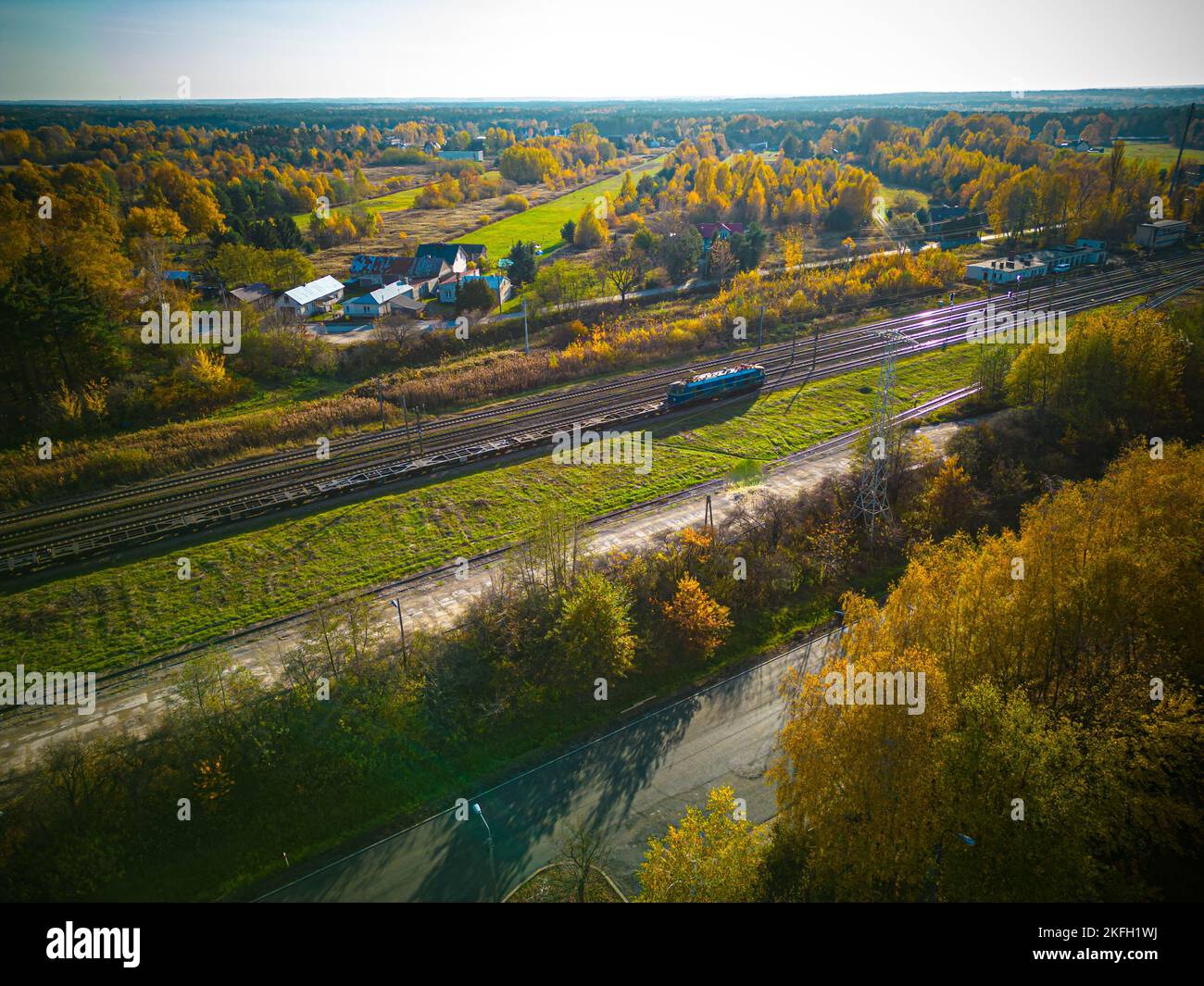 Aerial view of cargo train, a double-track railway in countryside ...