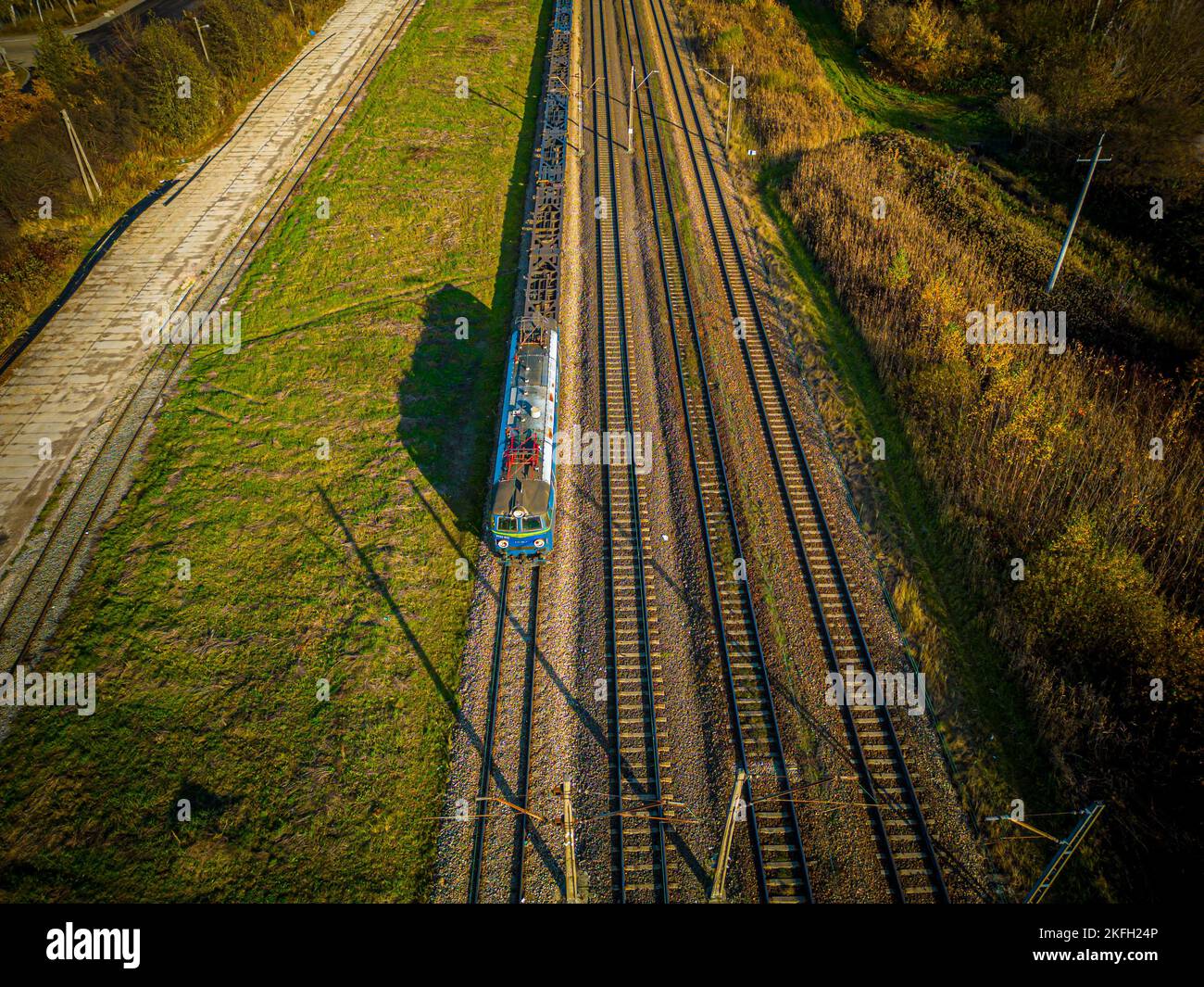 Aerial view of cargo train, a double-track railway in countryside ...