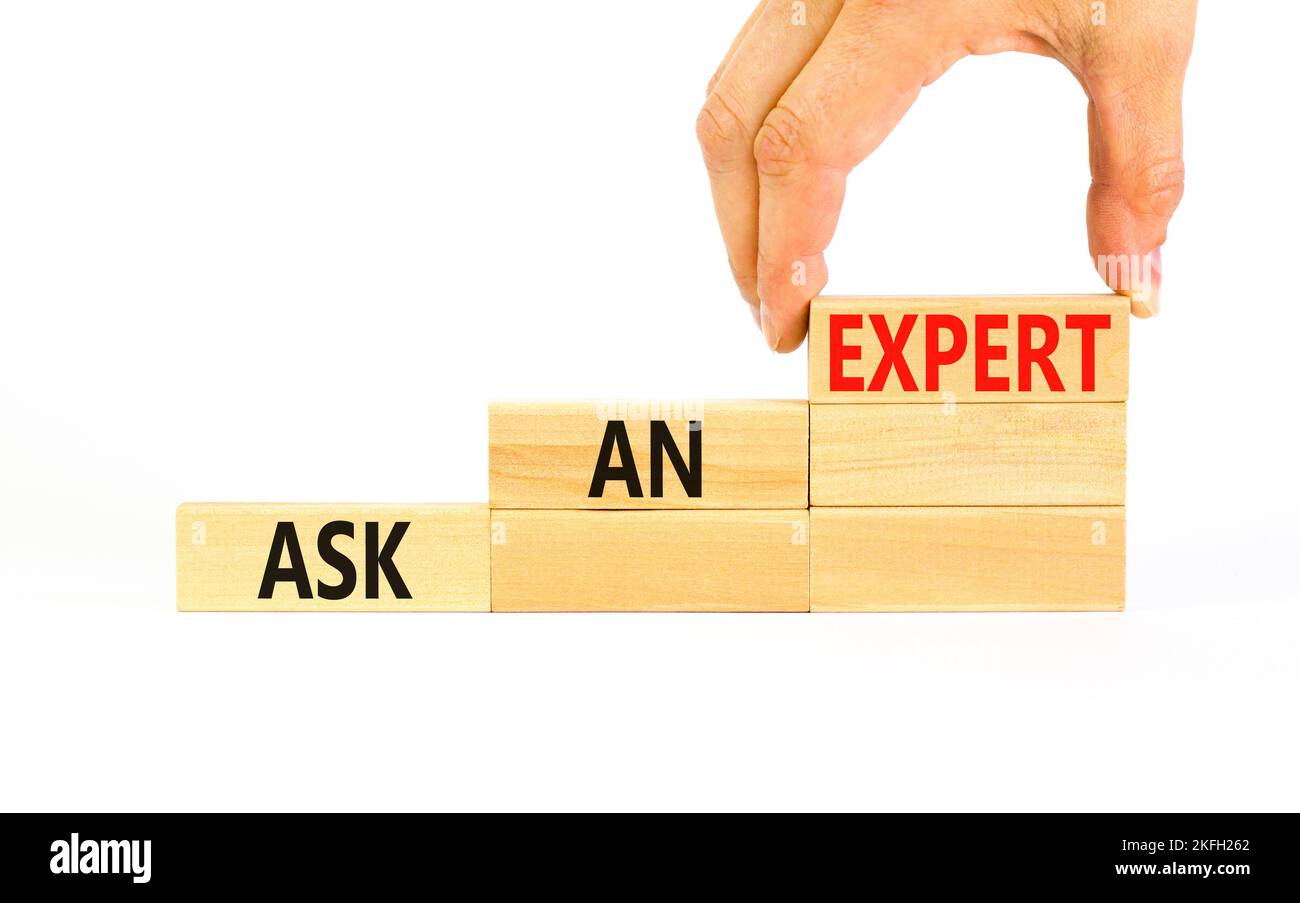 Ask an expert symbol. Concept words Ask an expert on wooden blocks on a ...