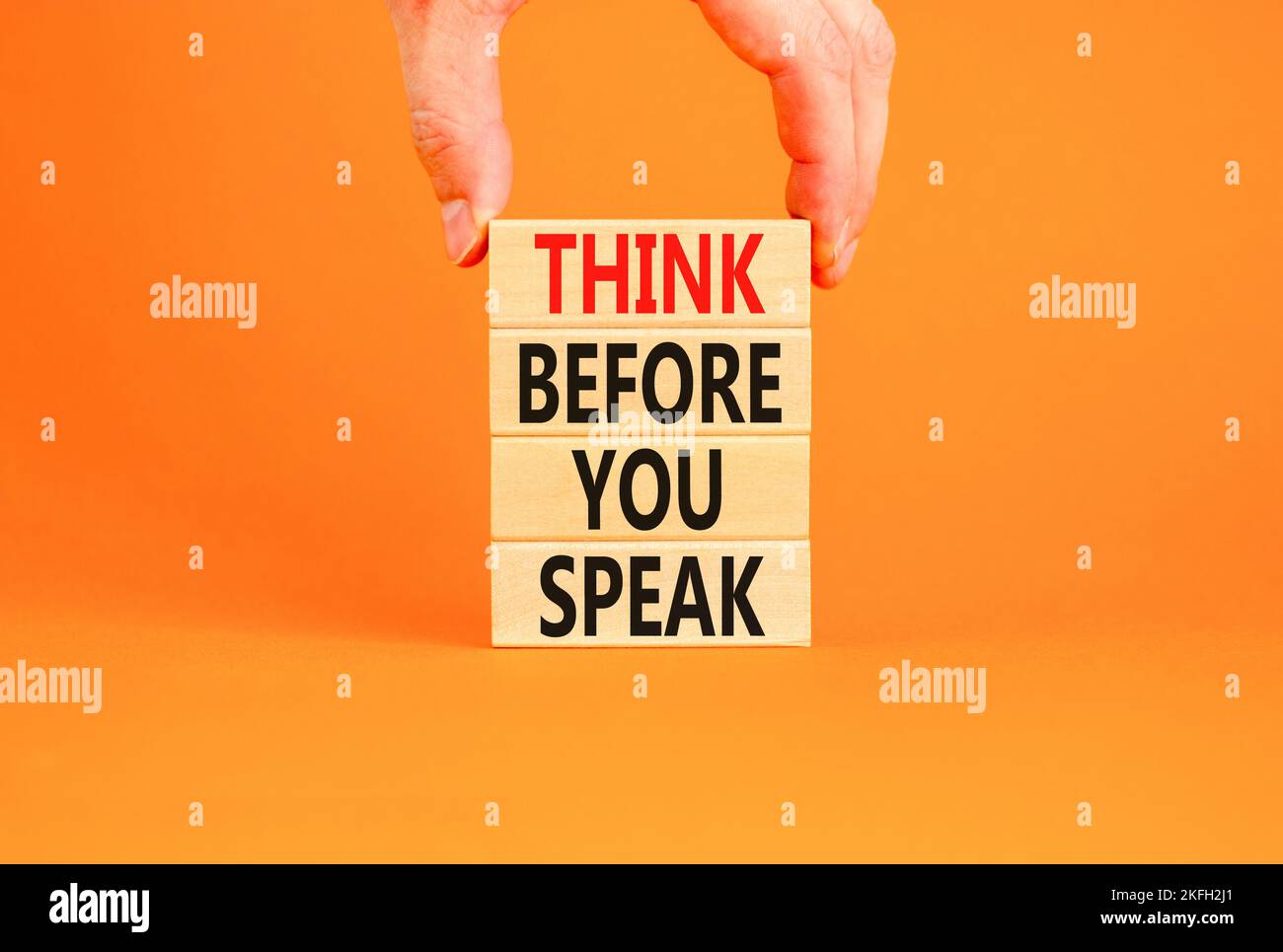Think before you speak symbol. Concept words Think before you speak on wooden cubes. Beautiful ...