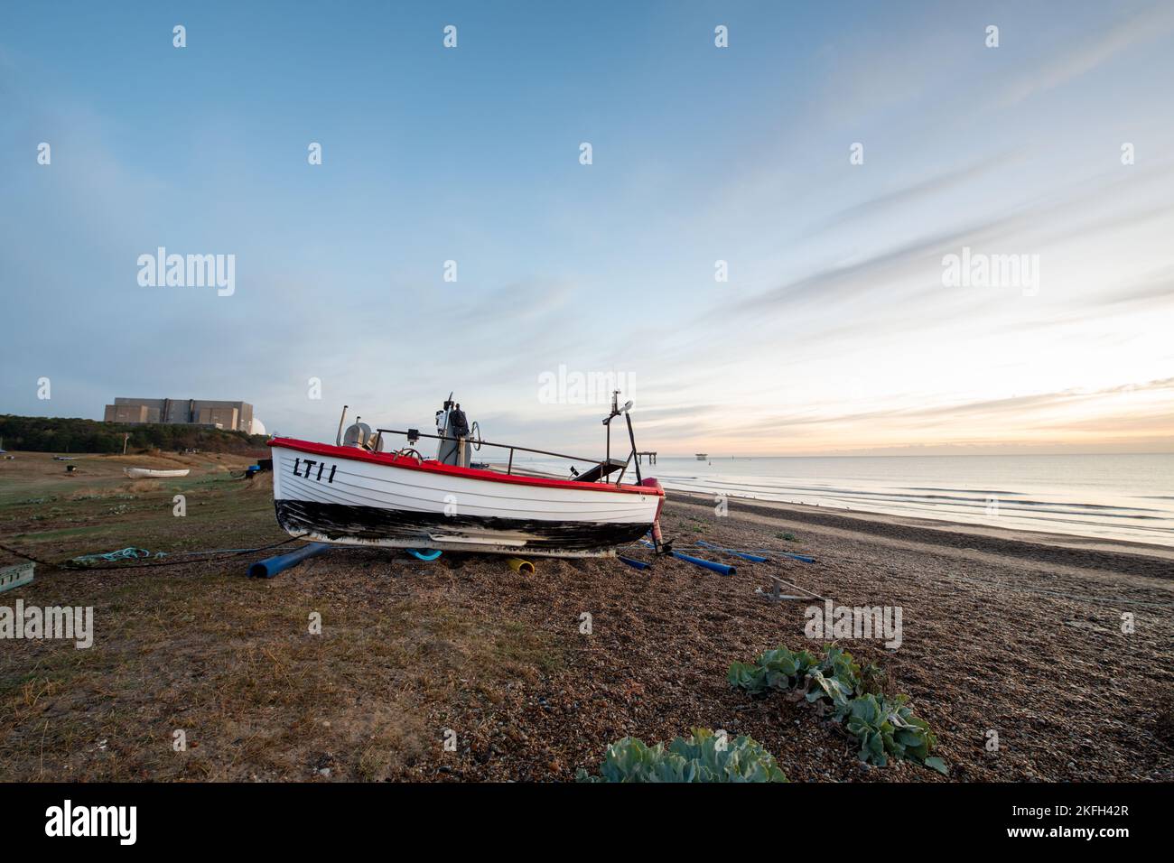 Fishing boats on the beach in front of the nuclear power station at ...