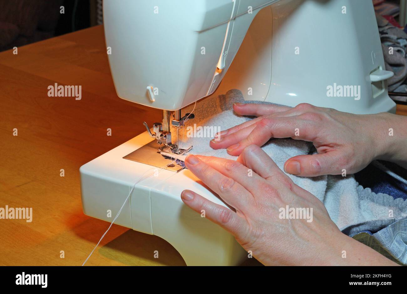 Hands seamstress using sewing hi-res stock photography and images - Alamy