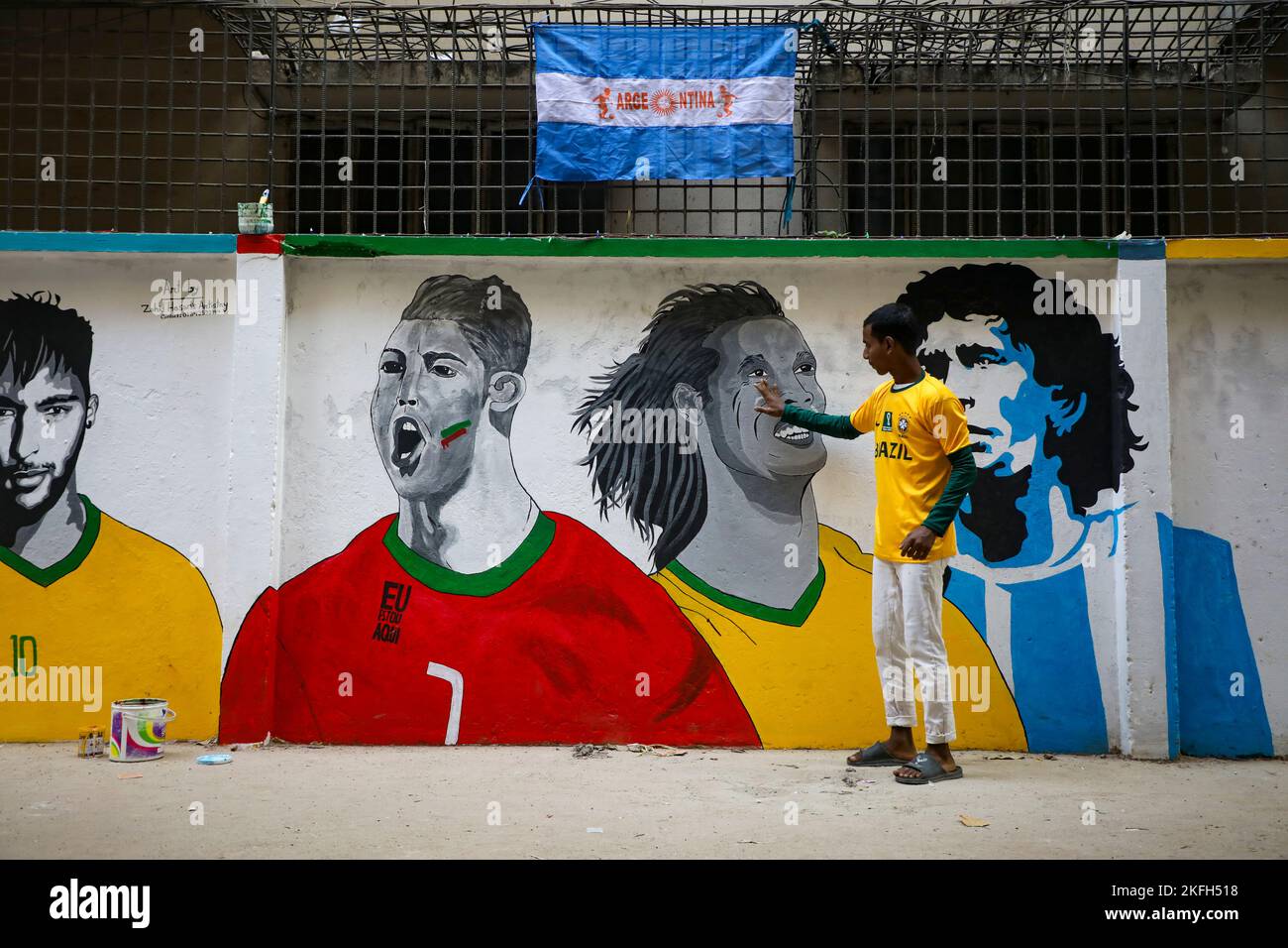An Argentina fan touch his favorite player in a graffiti ahead of FIFA ...