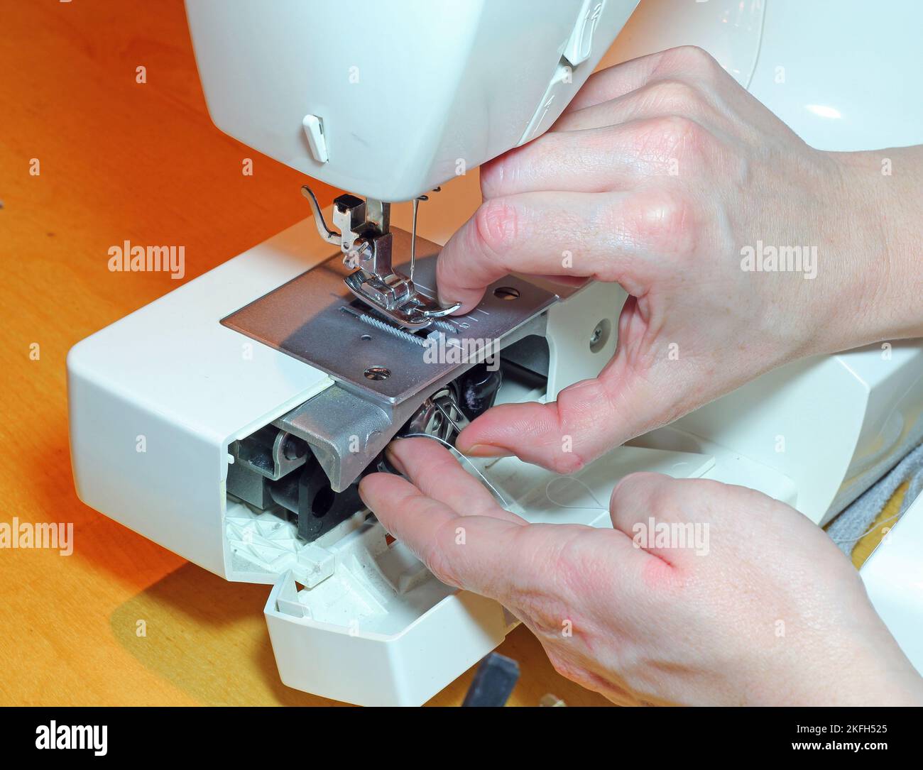 Hands seamstress using sewing hi-res stock photography and images - Alamy