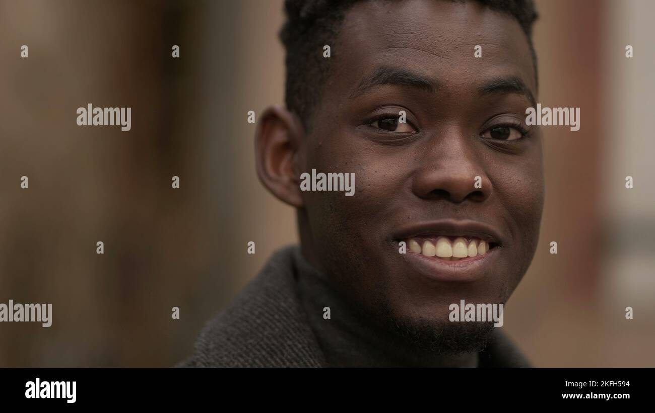 Friendly young black man smiling at camera. Charismatic handsome ...