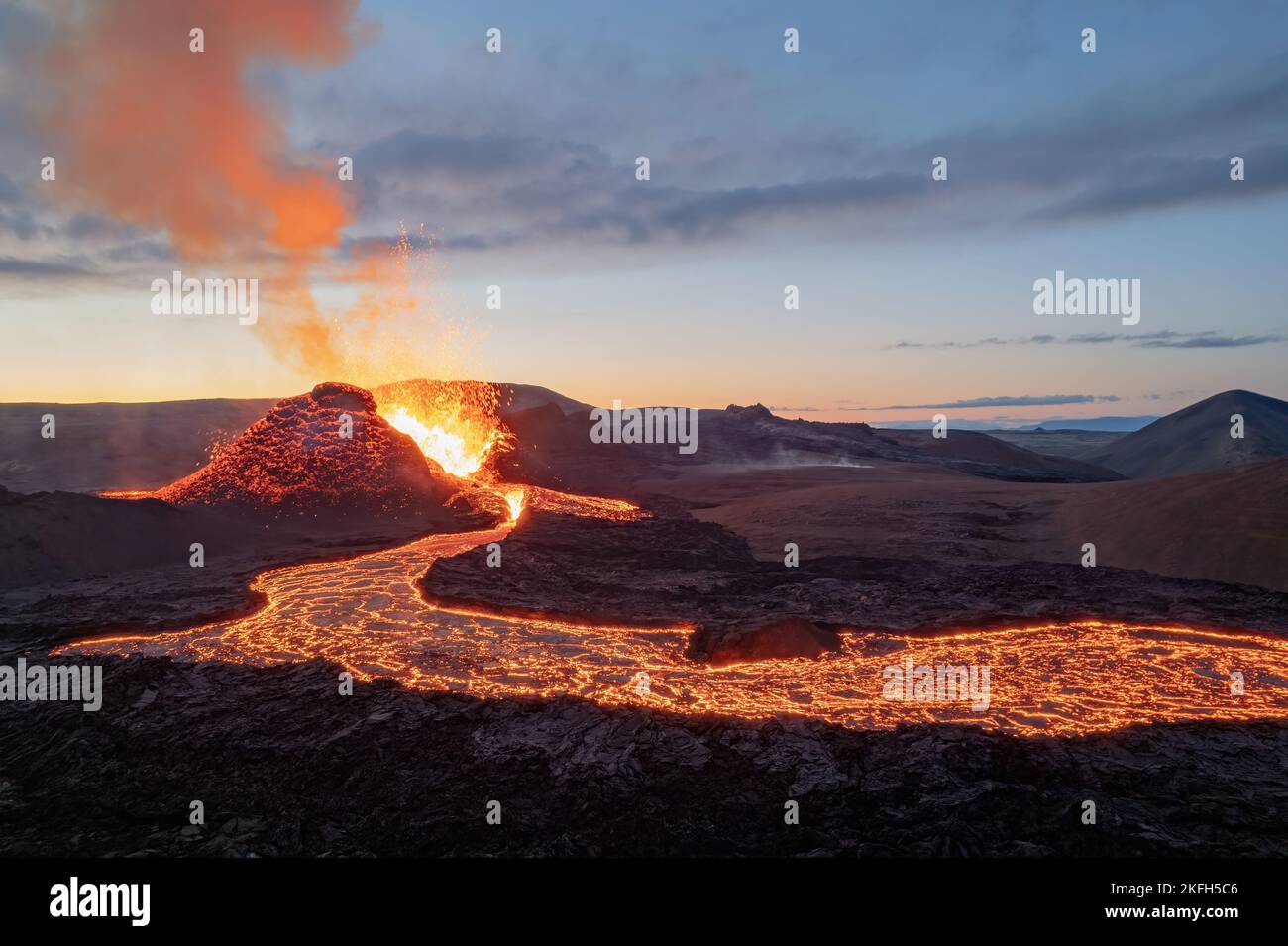 An aerial view of lava pouring out of an erupting volcano in Iceland ...