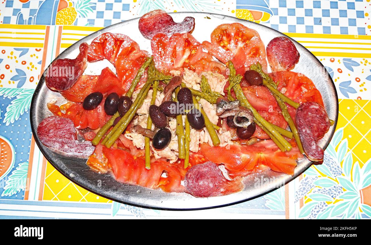 Combination plate of egg, asparagus, artichokes, piquillo pepper and ...