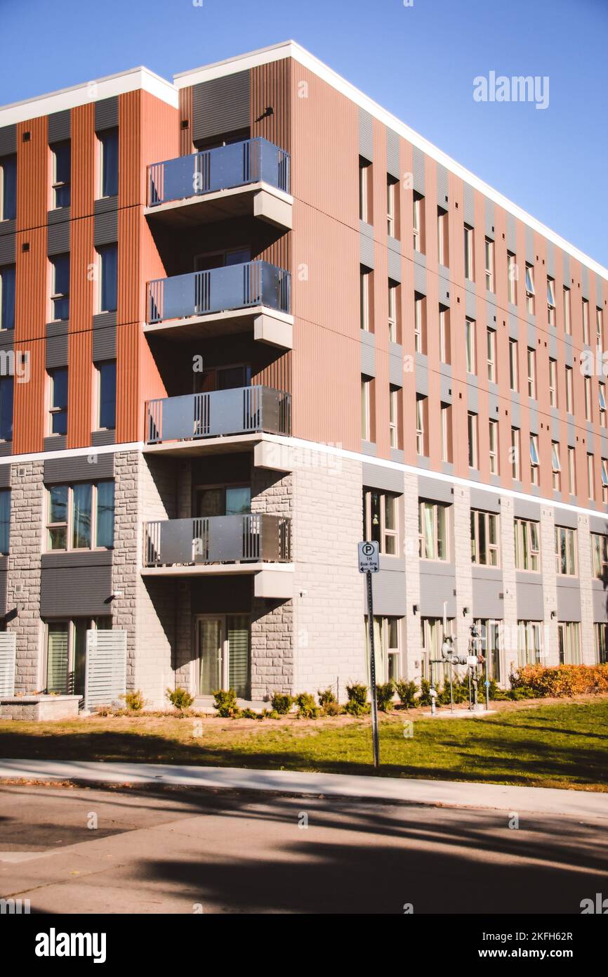 A vertical shot of a five-story residential building Stock Photo - Alamy