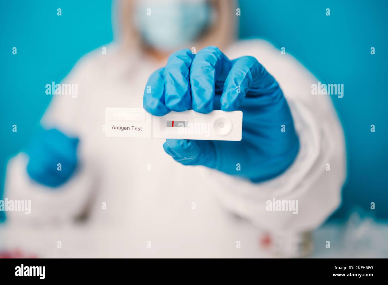 A laboratory employee taking sample PCR microtubes with cotton swab ...