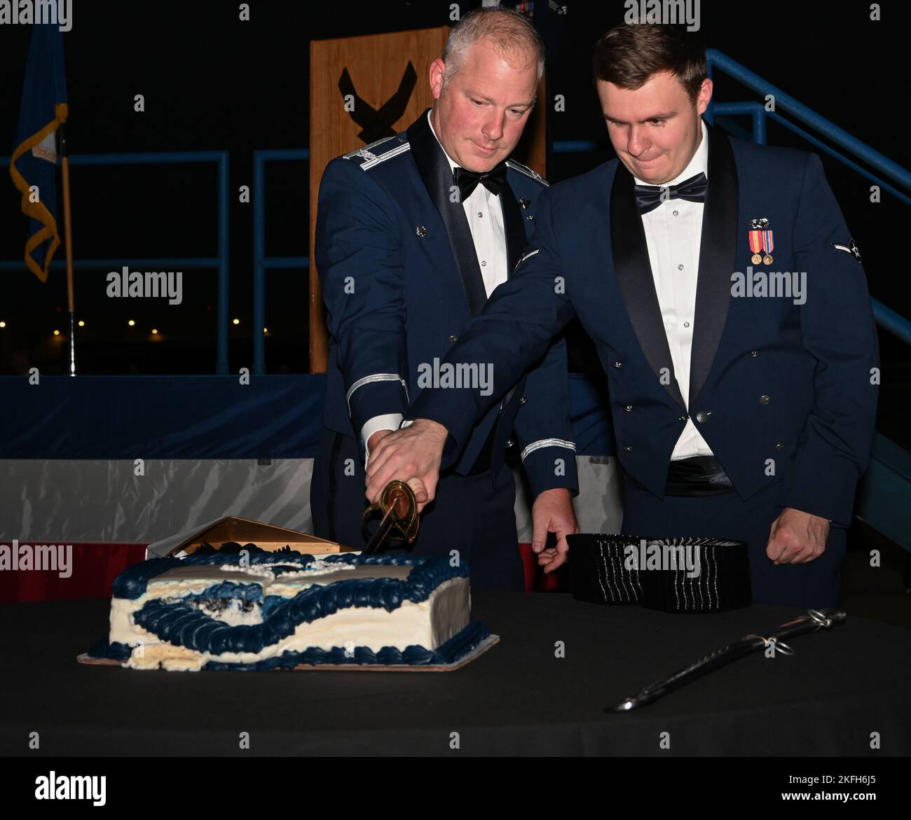 Col. Daniel Diehl, 509th Bomb Wing commander, helps cute the cake at ...