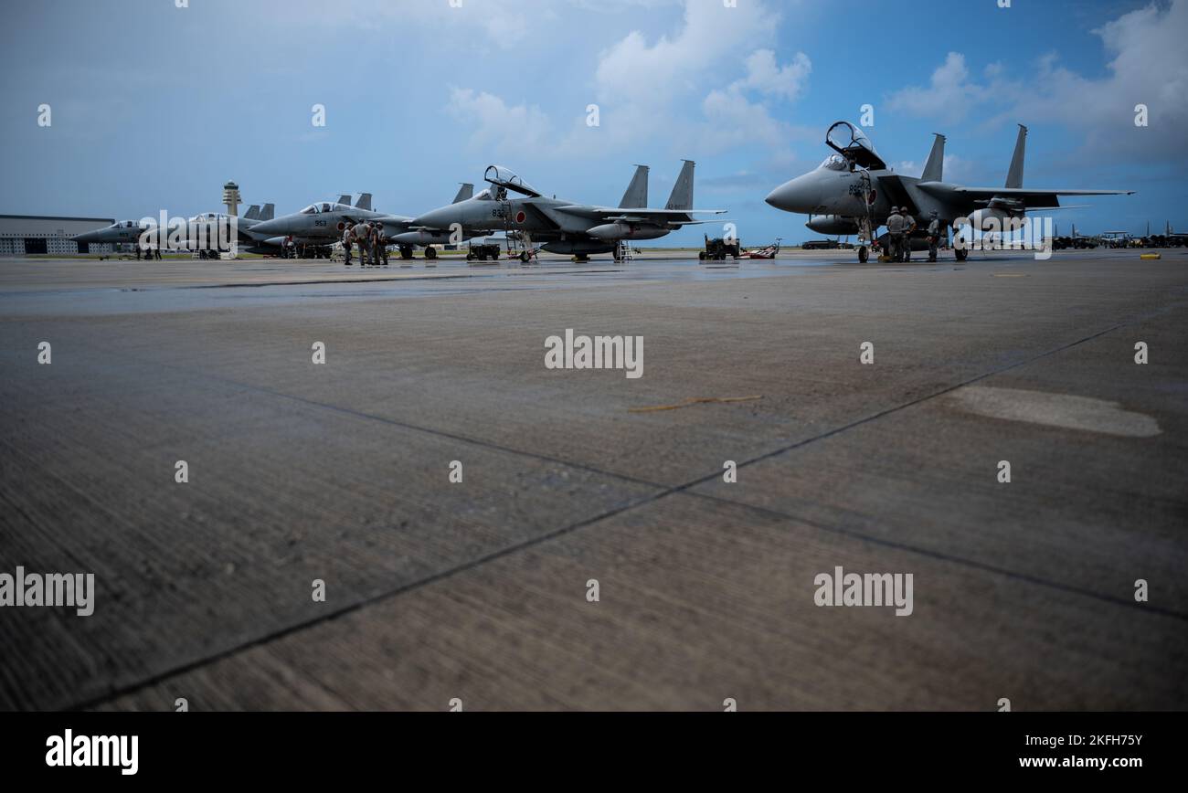 Japan Air Self-Defense Force F-15s are prepped for take-off in support ...