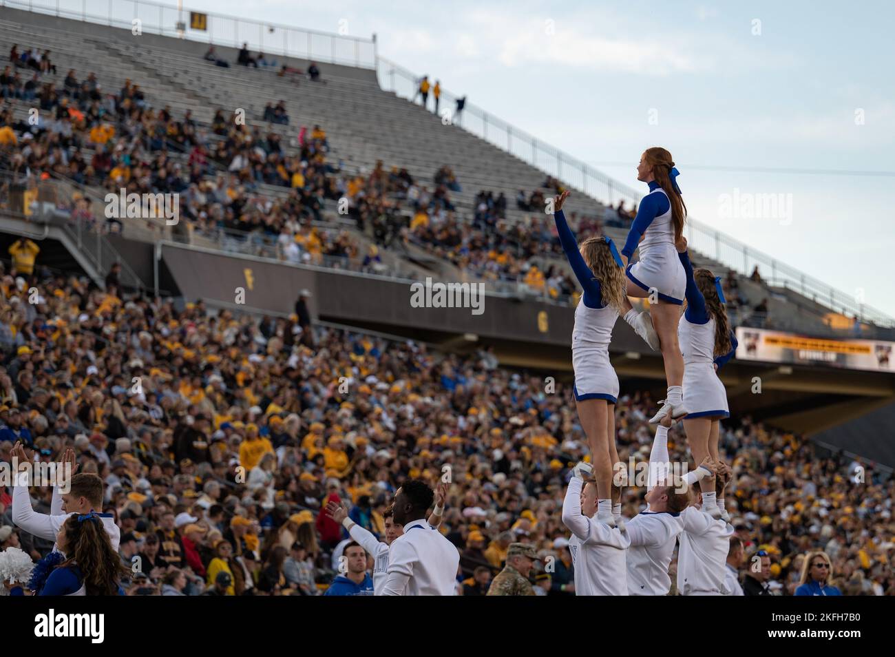The Air Force Academy cheer team performs stunts during a football game ...