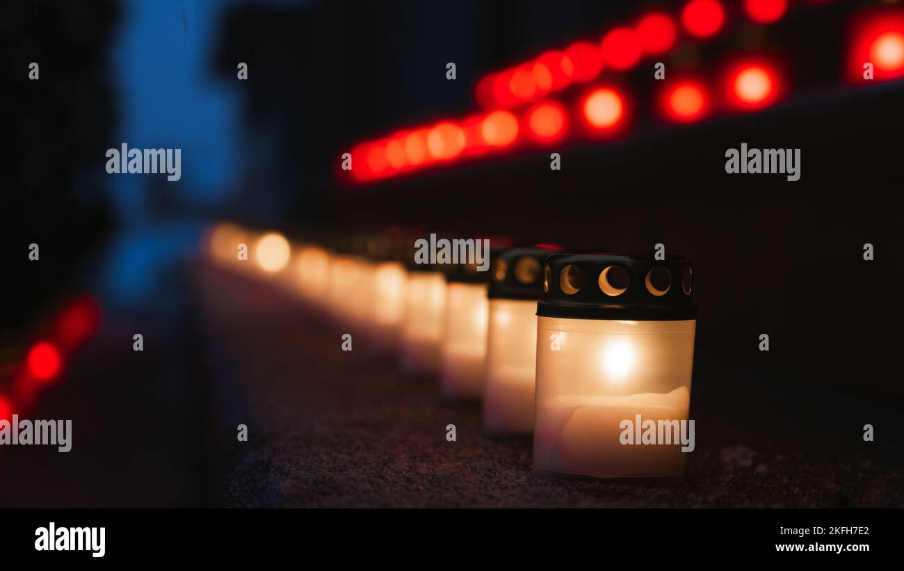Red and white burning candles on steps symbolizing Latvian flag ...
