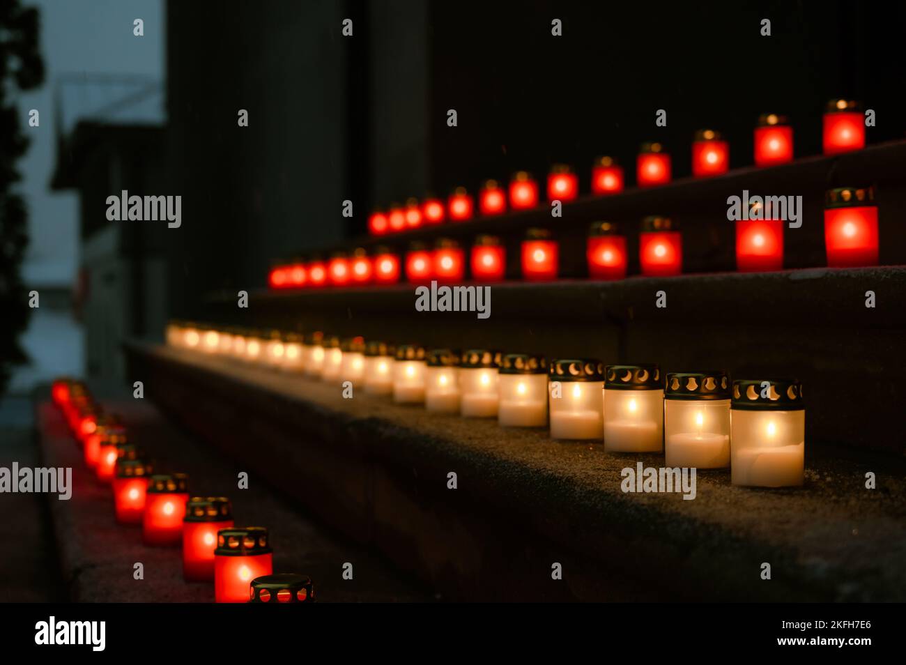 Red and white burning candles on steps symbolizing Latvian flag ...