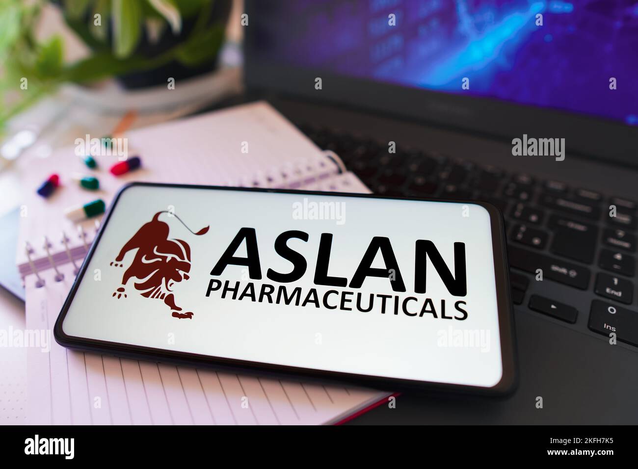 In this photo illustration, the Aslan Pharmaceuticals logo is displayed ...