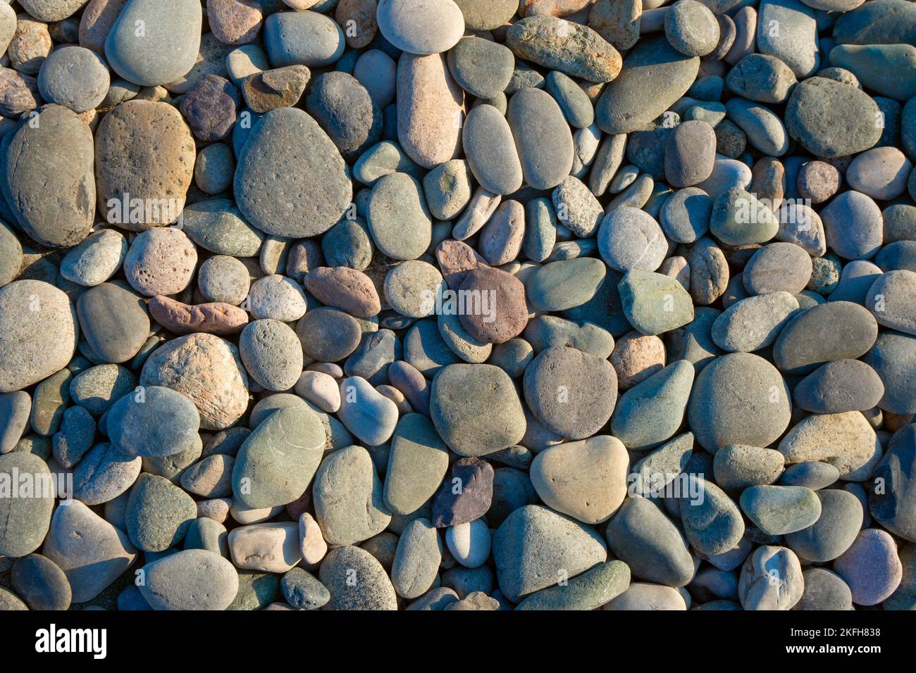 Rounded grey granite rocks beach hi-res stock photography and images ...
