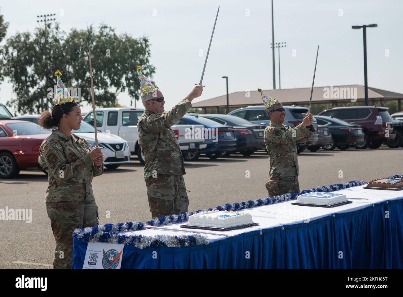 Col. Jason Eckberg (middle) and Chaplain Mario Rosario (right) perform ...