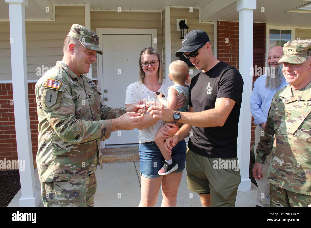 Col. Robert J. Holcombe, Fort Rucker garrison commander, hands the keys ...