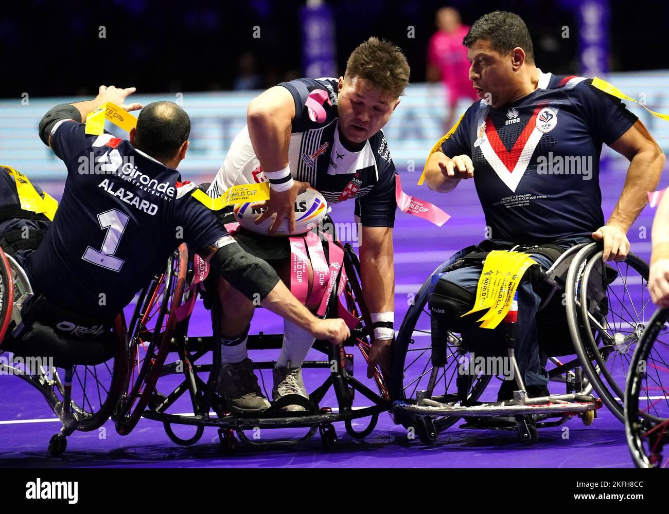 England's Tom Halliwell (centre) attempts to get past France's Lionel ...